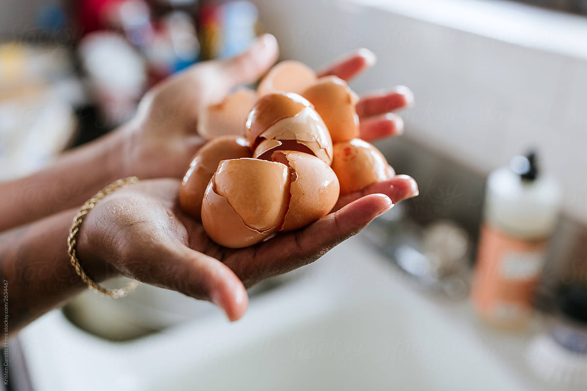 "African American Man Cooking And Breaking Eggs Into The Pot In The ...