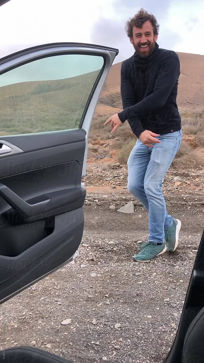 "Funny Male Dancing With Moving Car" by Stocksy Contributor "Ivan Gener ...