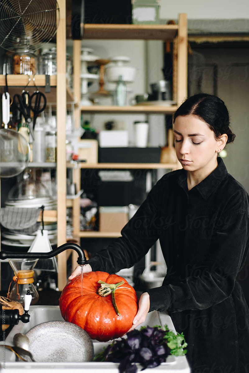 "Beautiful Female Washing Pumpkin" by Stocksy Contributor "Alina ...