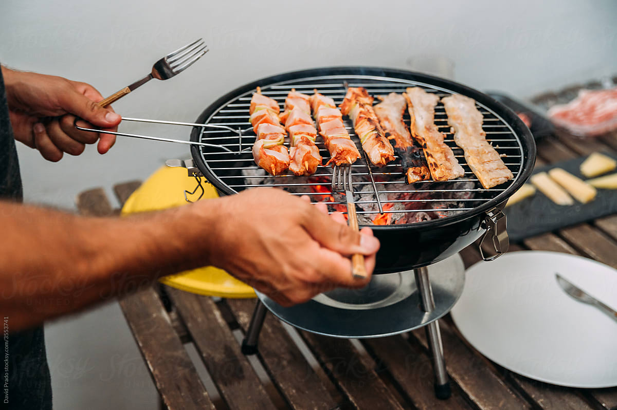 "Crop Man Cooking Meat On Grill" by Stocksy Contributor "David Prado ...