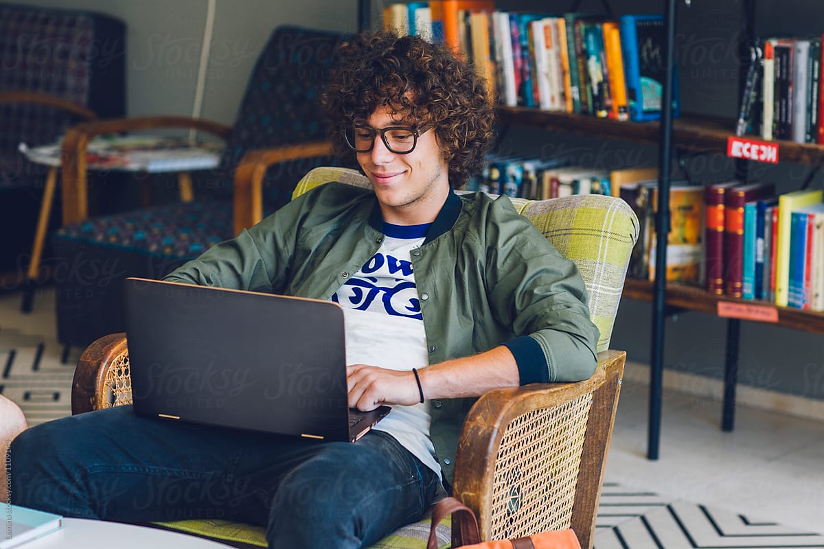 "A Boy Working On His Laptop In The Library" by Stocksy Contributor ...