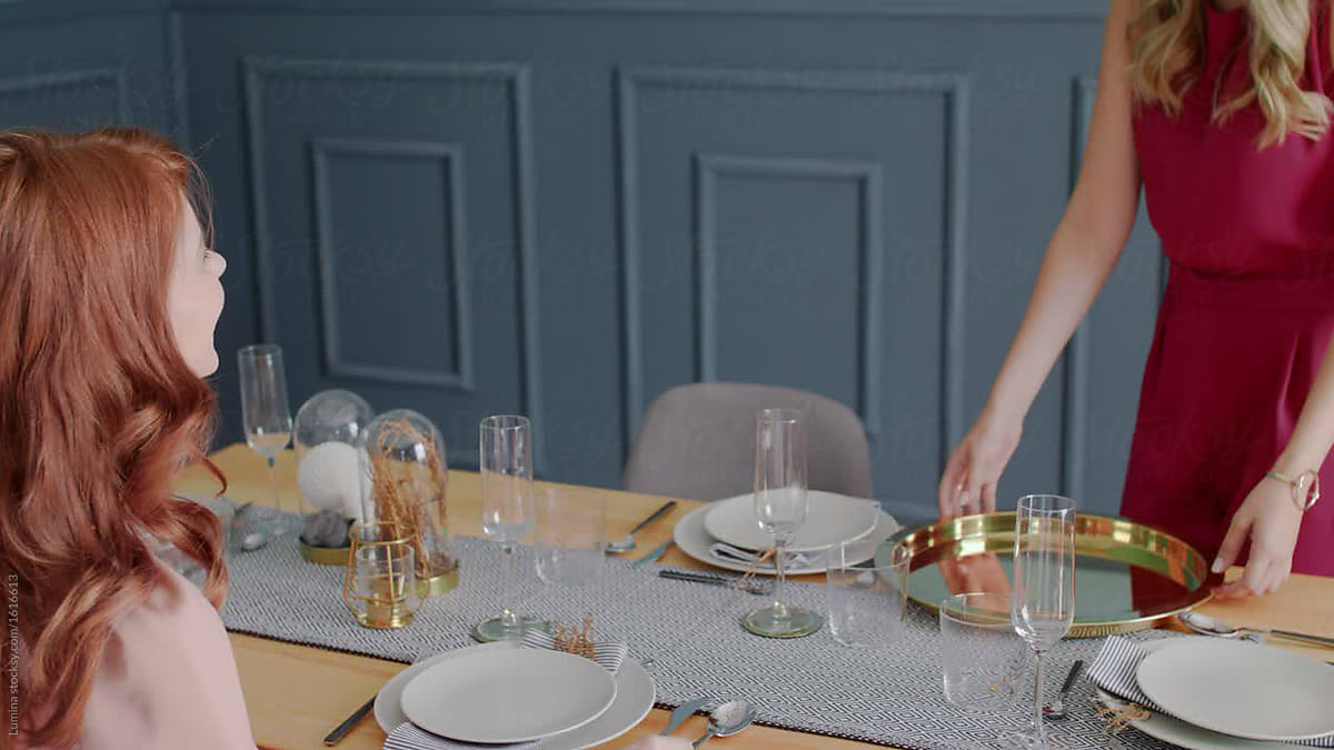 "Women Setting Up Christmas Dinner Table" by Stocksy Contributor ...