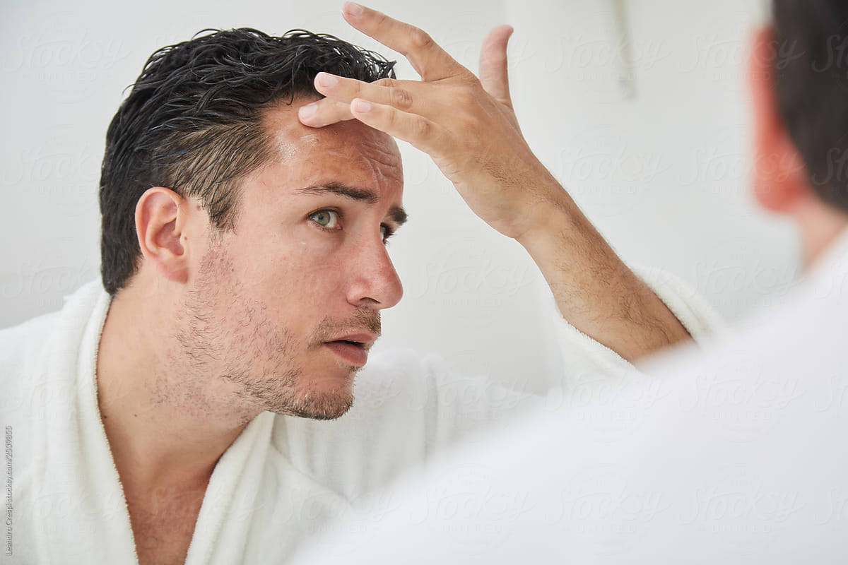 "Adult Man Applying Skin Lotion" by Stocksy Contributor "Leandro Crespi ...