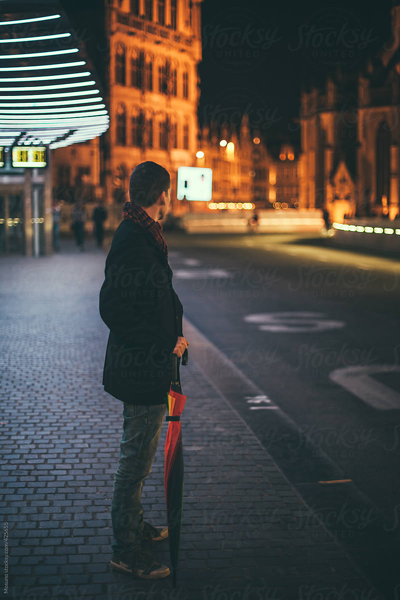 "Man Waiting For The Bus" by Stocksy Contributor "Mosuno" - Stocksy