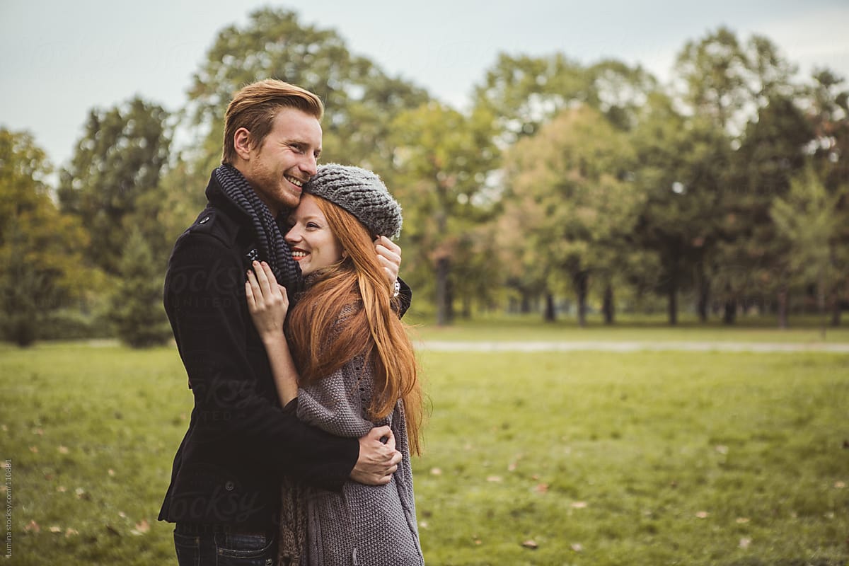 "Smiling Couple Hugging Outdoors" by Stocksy Contributor "Lumina" - Stocksy
