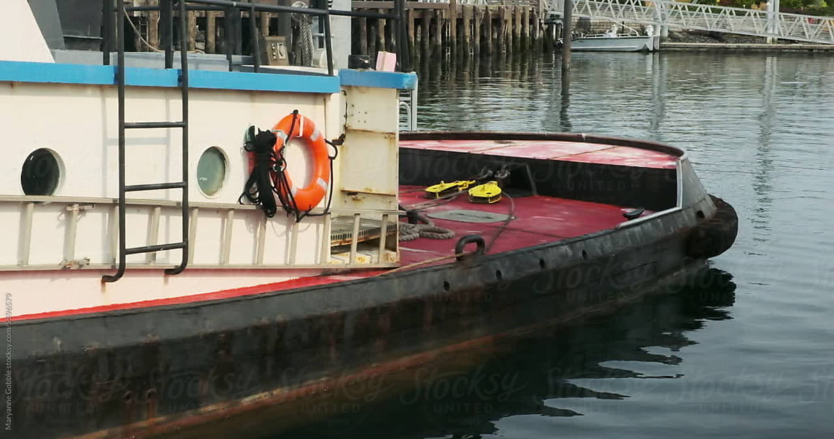 "Boat In Fishing Harbor" by Stocksy Contributor "Maryanne Gobble" - Stocksy