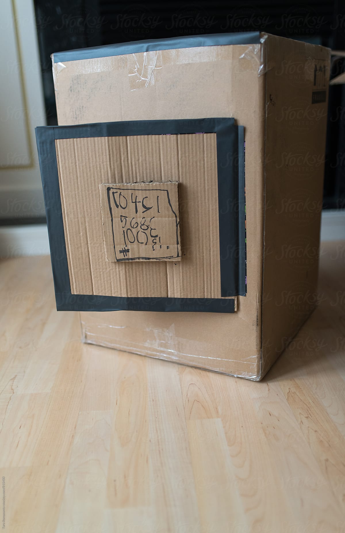 "Cardboard Box Decorated With Numbers Printed By Child" by Stocksy ...
