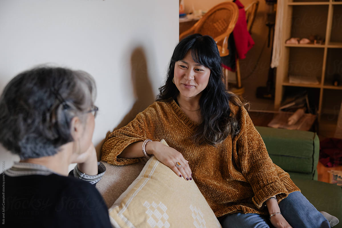 "Mother And Daughter Talking On Couch At Home." by Stocksy Contributor ...