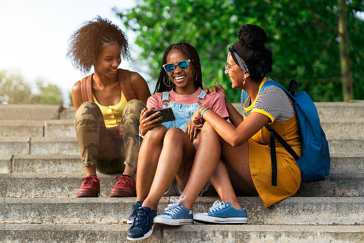 "Three African Teenage Girls Using A Smartphones" by Stocksy ...