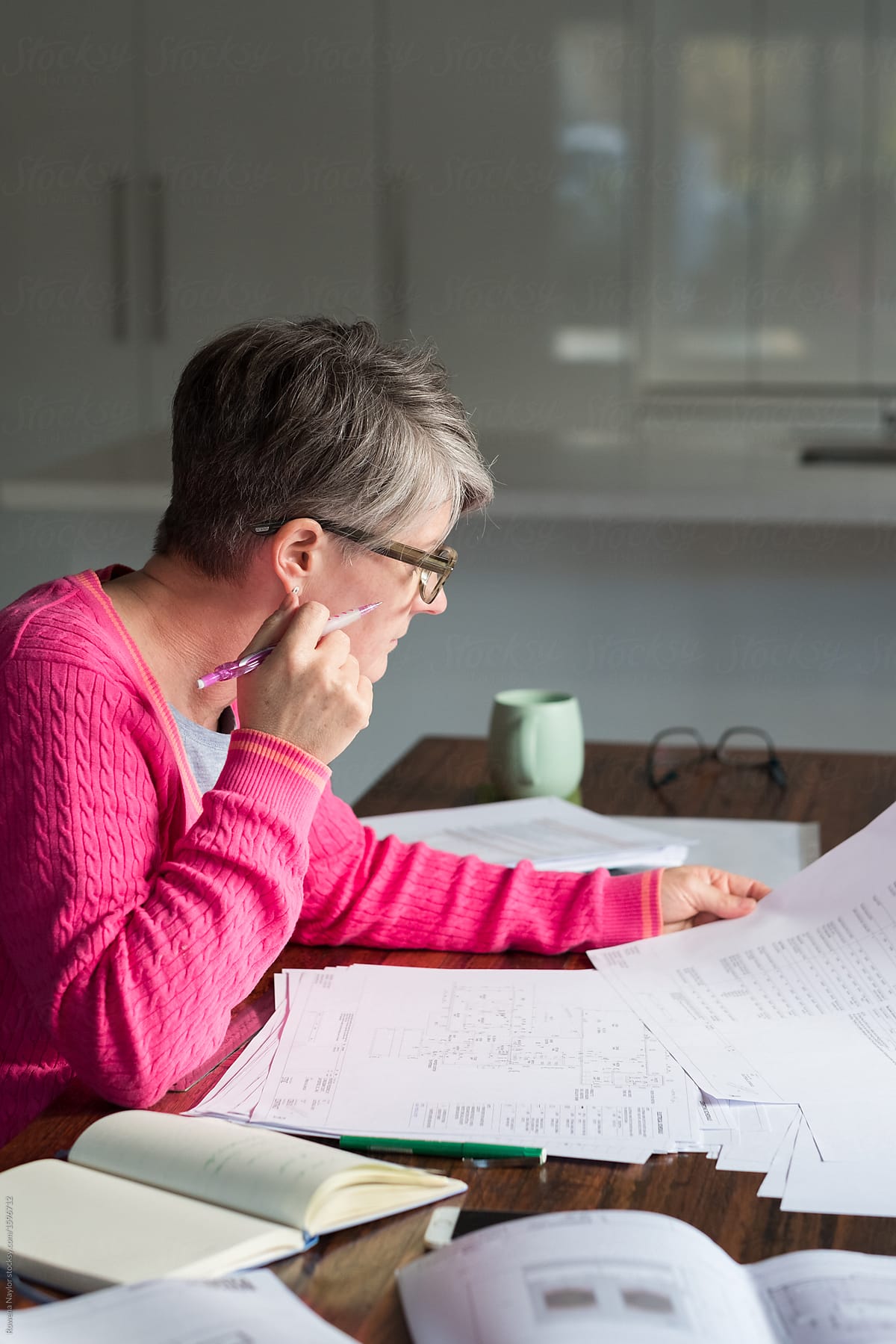 "Architect Working From Home Checking Architectural Drawings" by ...