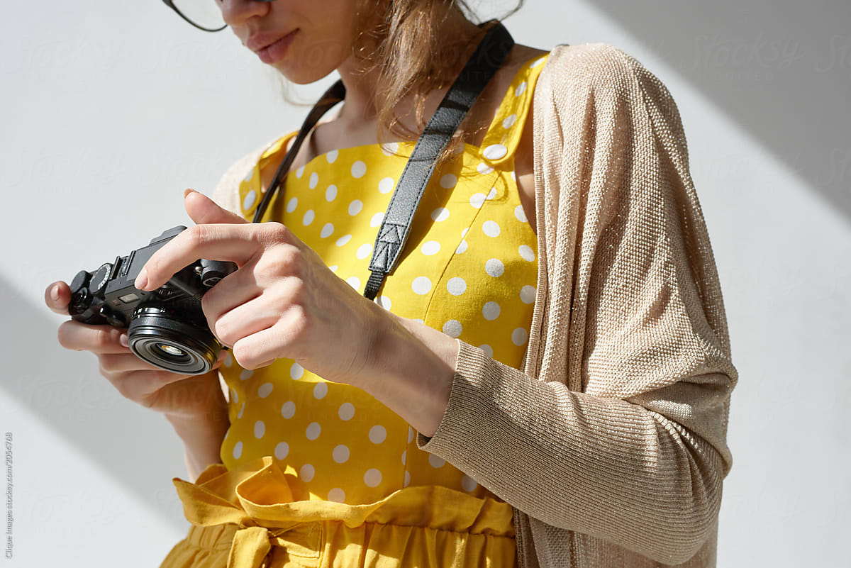 "Pretty Girl With Camera" by Stocksy Contributor "Clique Images" - Stocksy