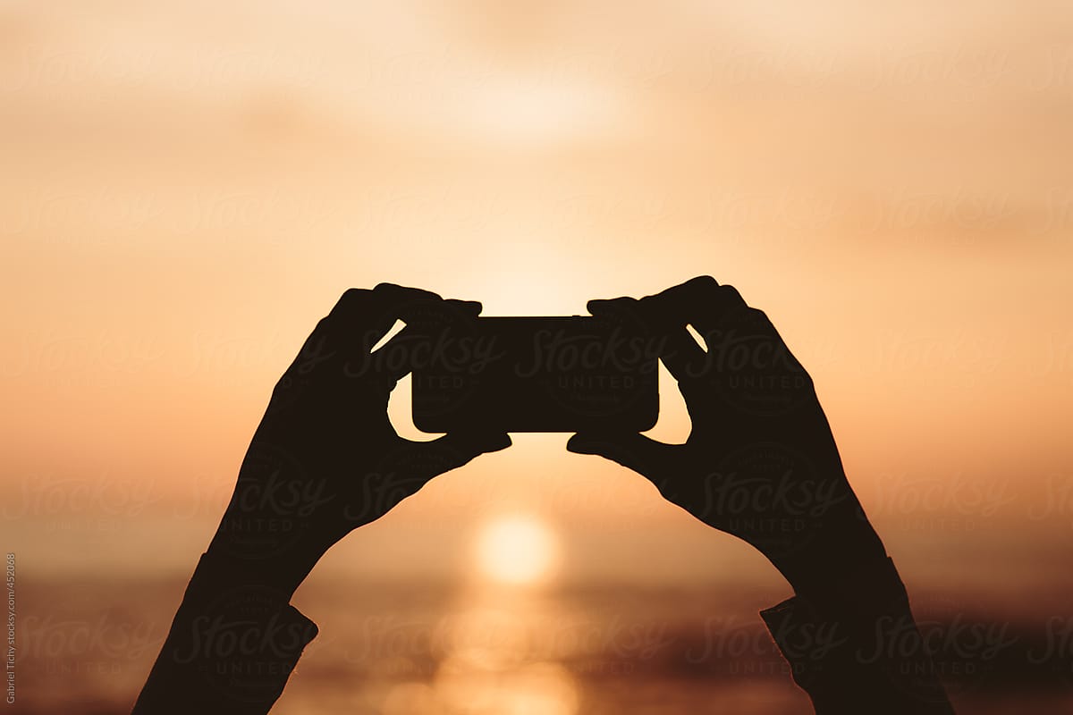 "Silhouette Of Hands Photographing Sunset" by Stocksy Contributor ...