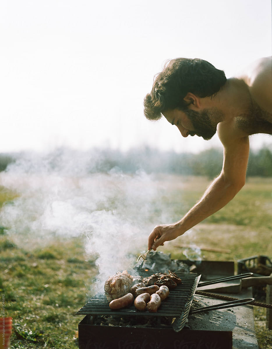 "A Beautiful Man Making A Barbecue" by Stocksy Contributor "Anna ...