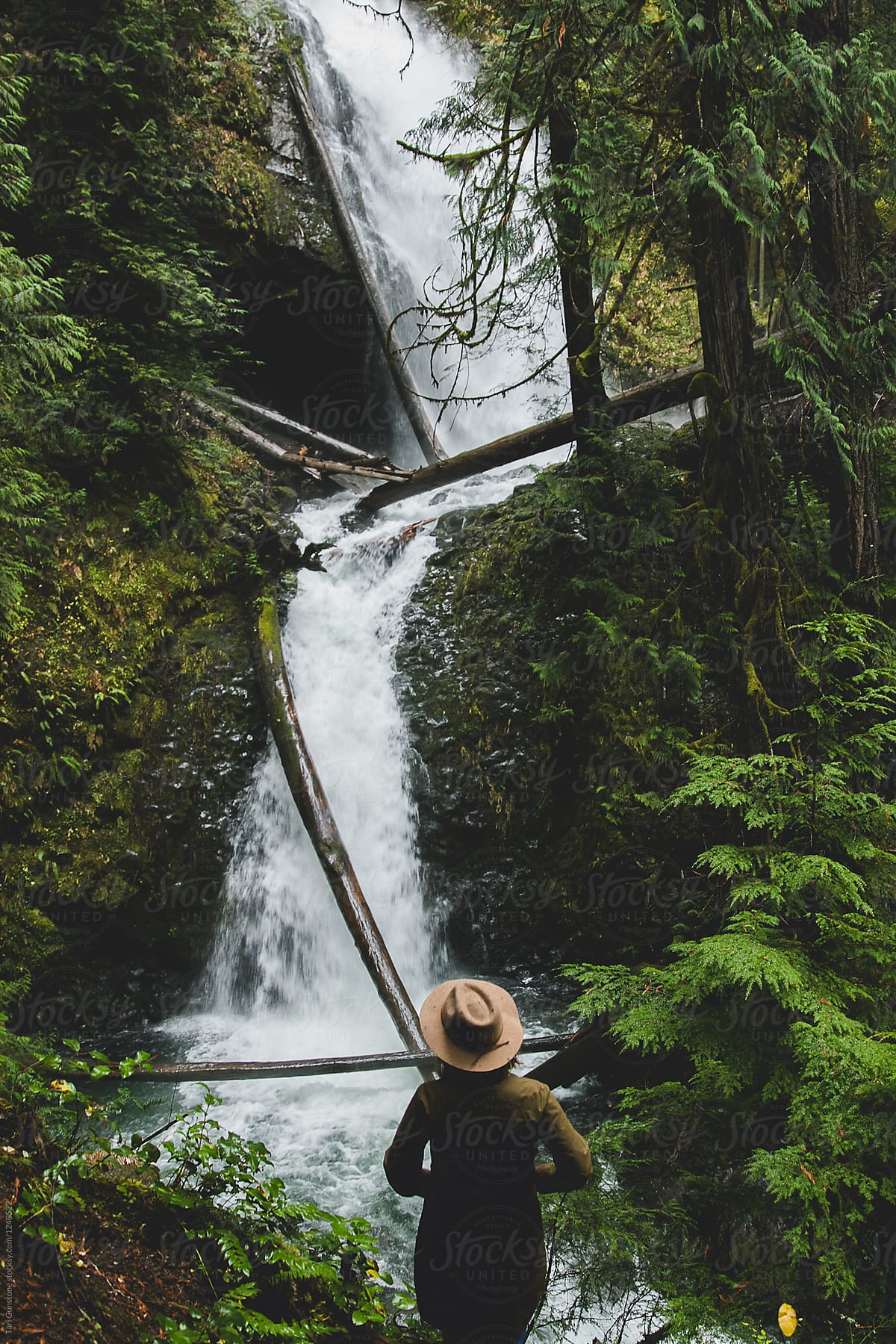 "Woman And Waterfall" by Stocksy Contributor "Tari Gunstone" - Stocksy