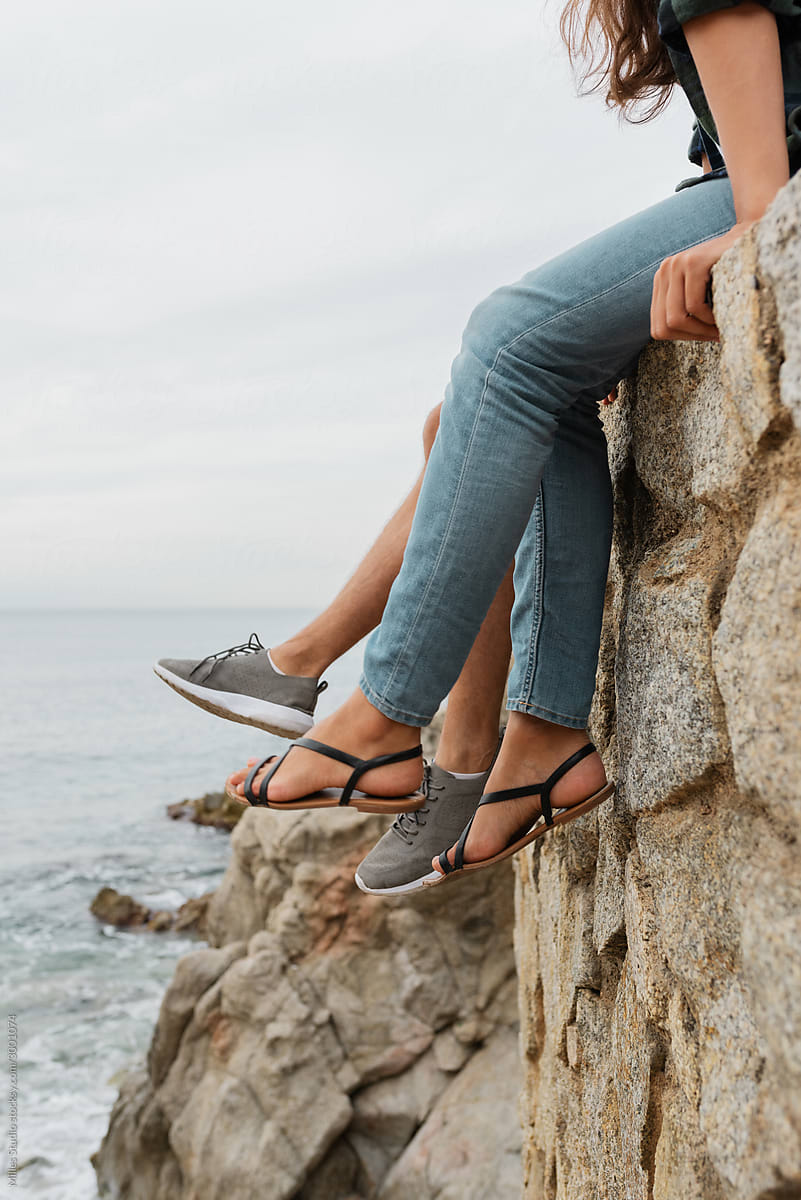 "Crop Man And Woman Swinging Legs Near Sea" by Stocksy Contributor ...