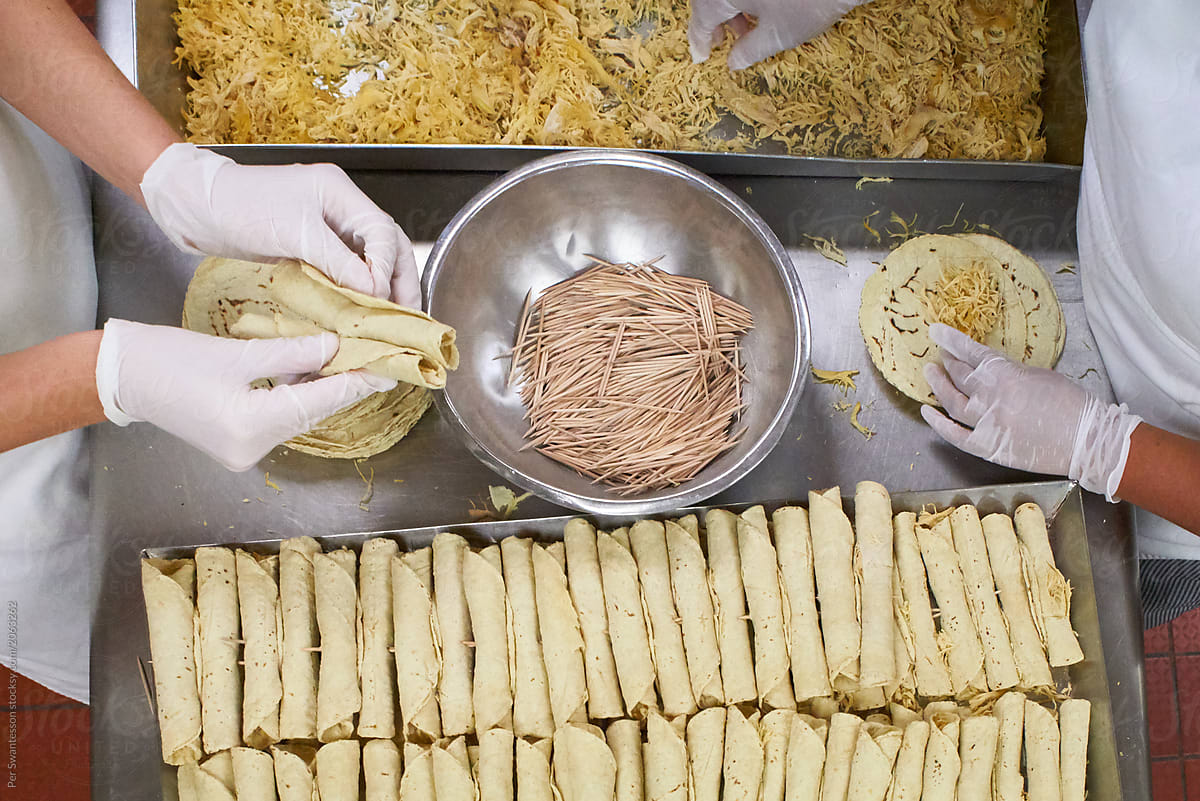 "Preparation Of Mexican Enchiladas In A Large Restaurant" by Stocksy ...