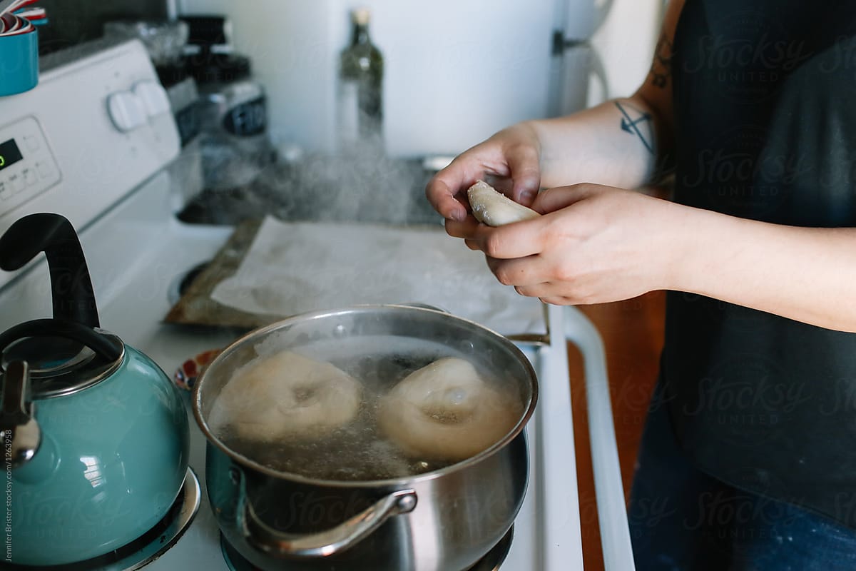 "Woman Puts Bagel In Boiling Water" by Stocksy Contributor "Jennifer ...