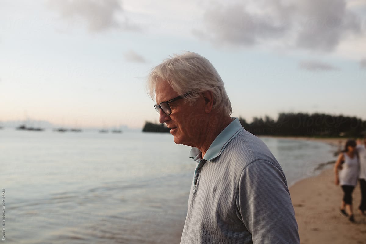 "Man On The Beach In Hanalei Bay" by Stocksy Contributor "Ryan Tuttle ...