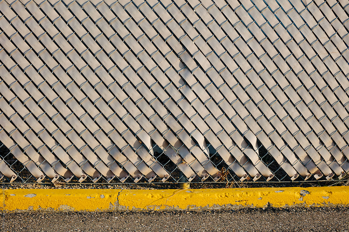 "Detail Of Worn Chain-link Fence And Sidewalk Curb" by Stocksy ...