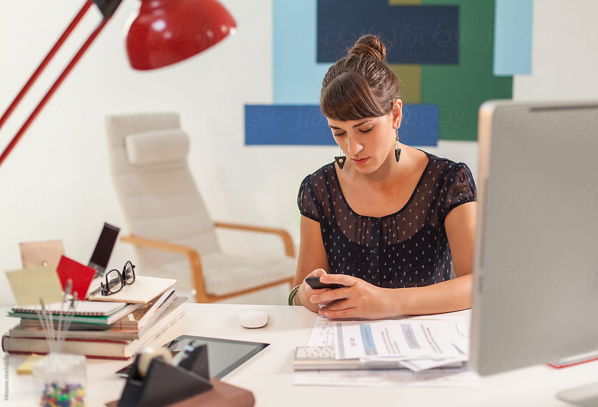 "Young Woman At Work" by Stocksy Contributor "Mosuno" - Stocksy
