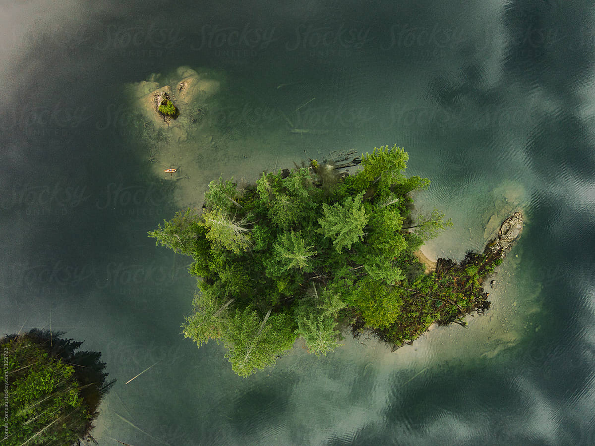 "Tiny Island From Above On Cloudy Day" by Stocksy Contributor "Ronnie ...