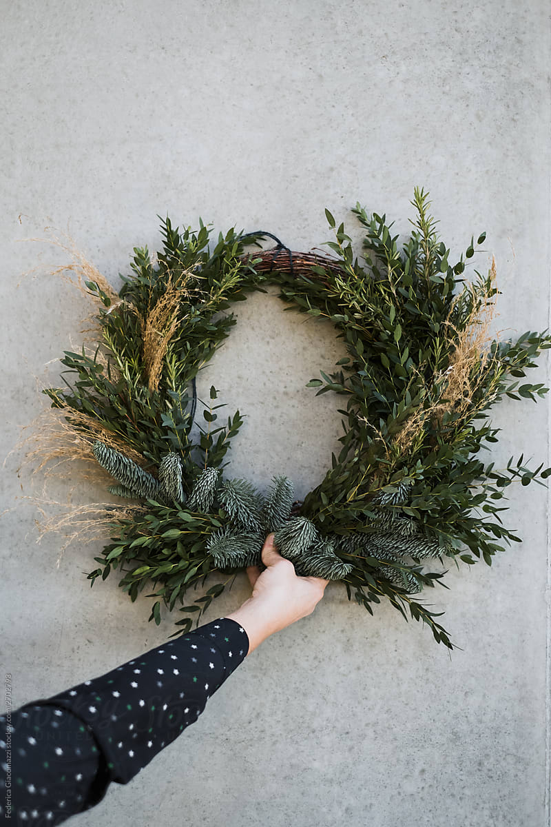 "Woman Florist Assembling A Garland" by Stocksy Contributor "Federica ...