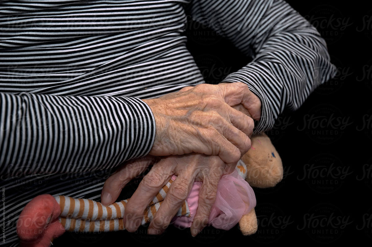 "Elderly Woman's Hands And Doll" by Stocksy Contributor "Jørgen Krielen ...