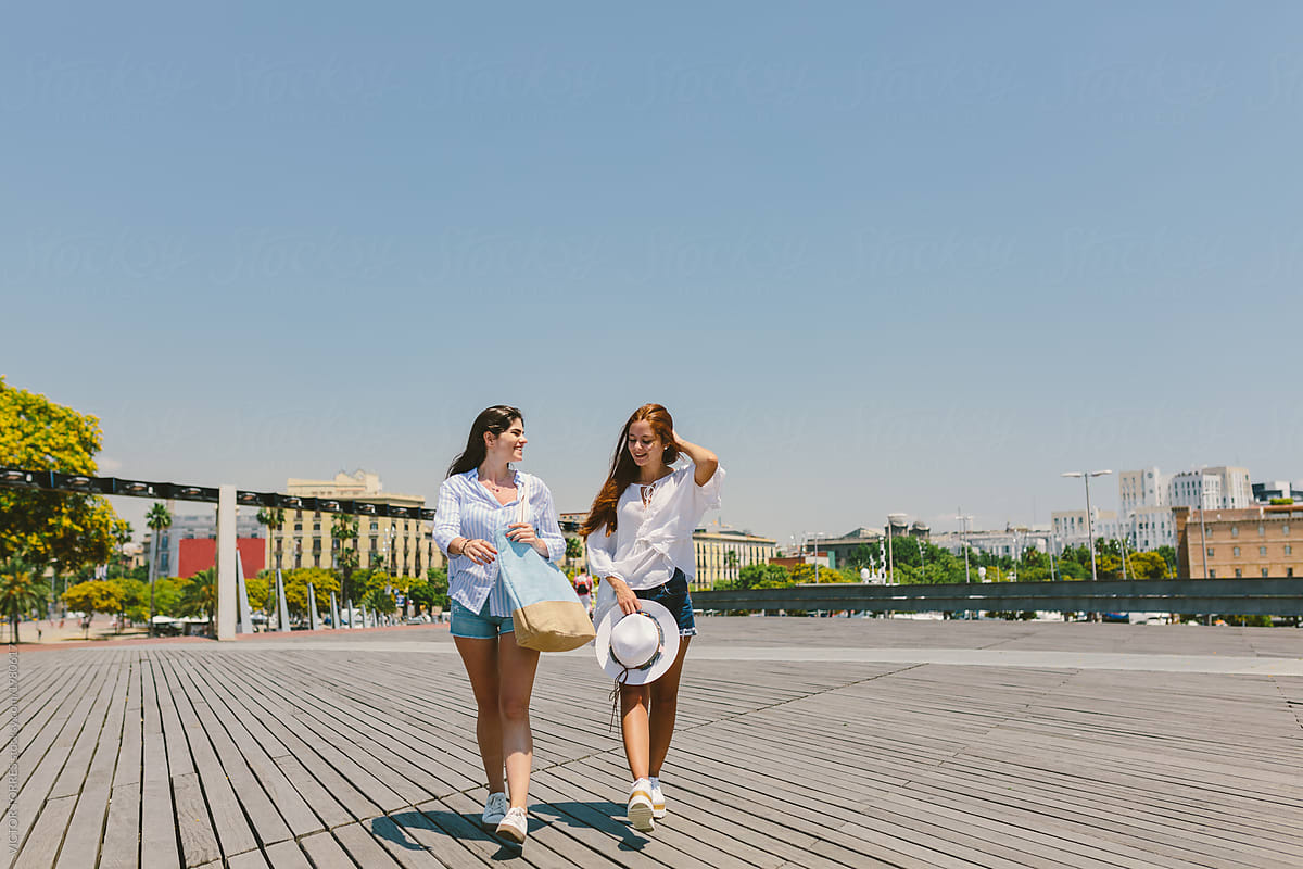 "Stylish Young Girls Having A Walk In Summertime." by Stocksy ...