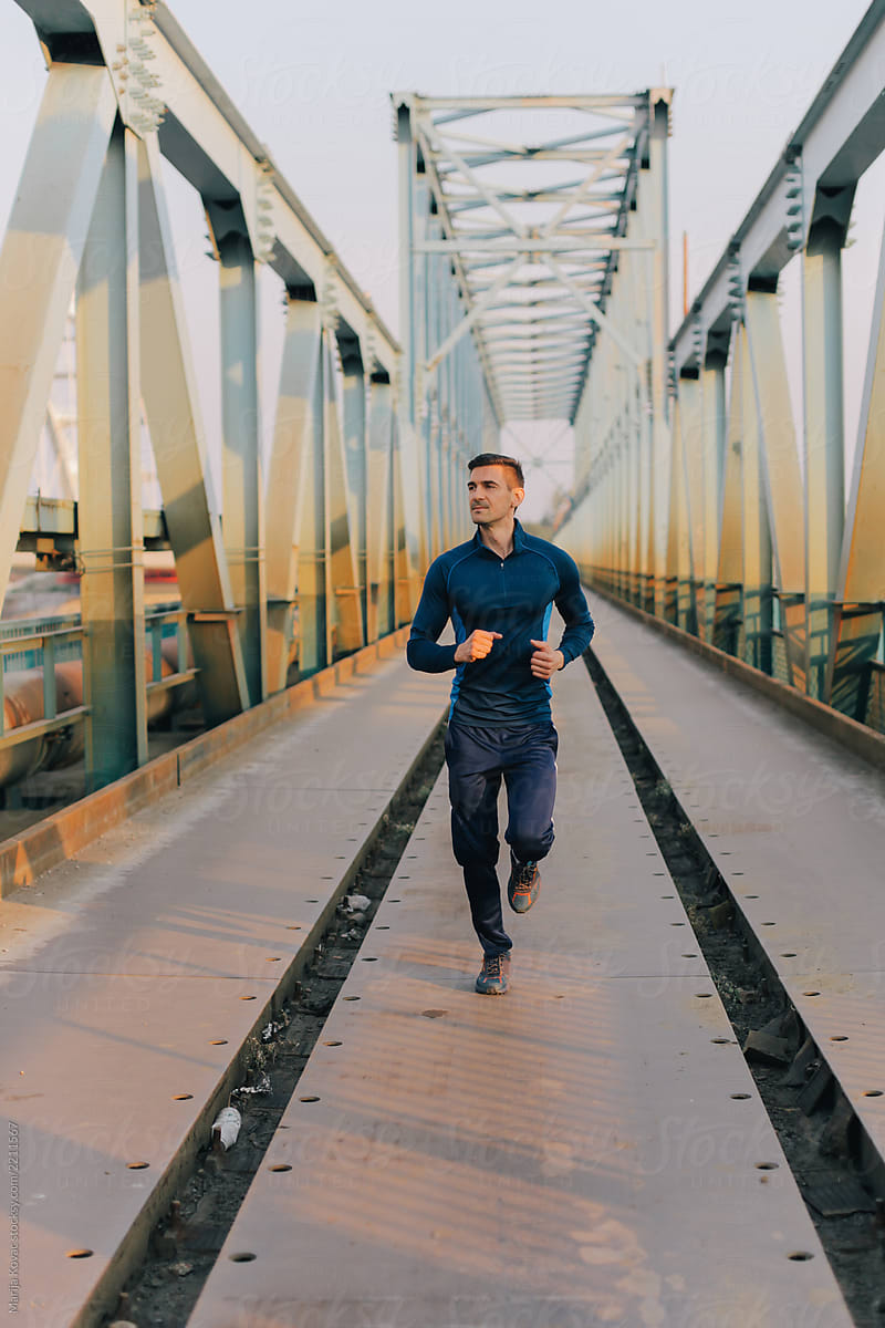 "Man Running Outdoor" by Stocksy Contributor "Marija Kovac" - Stocksy