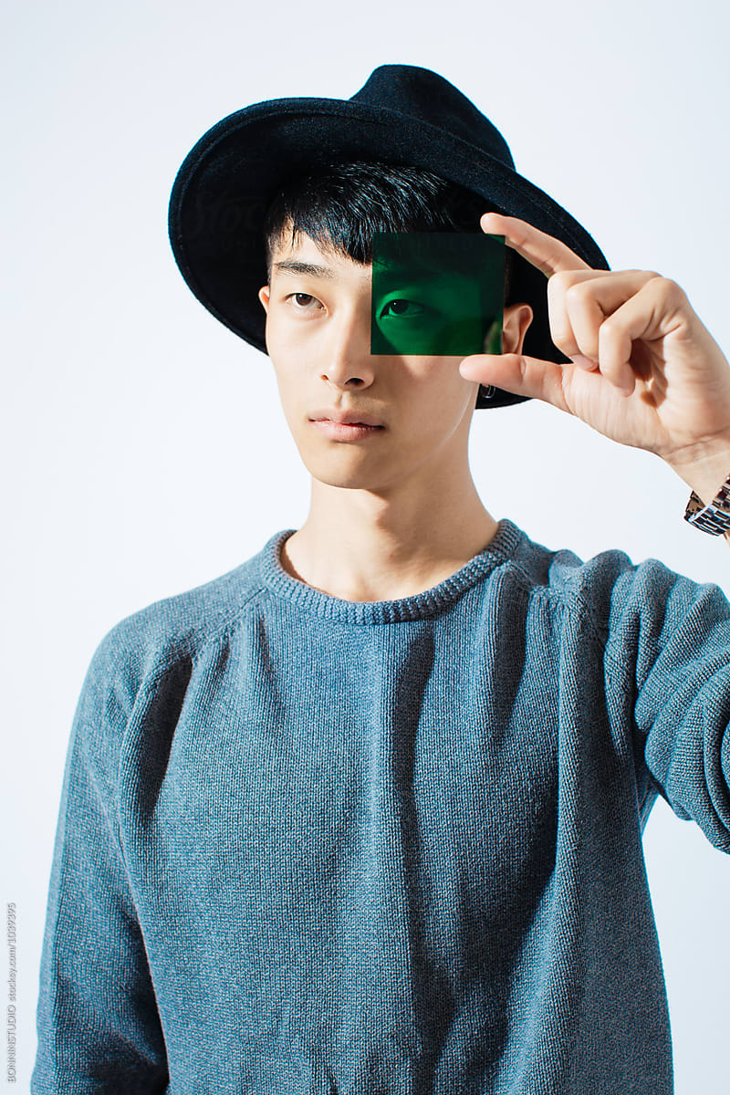 "Portrait Of An Asian Man Holding A Green Glass." by Stocksy ...