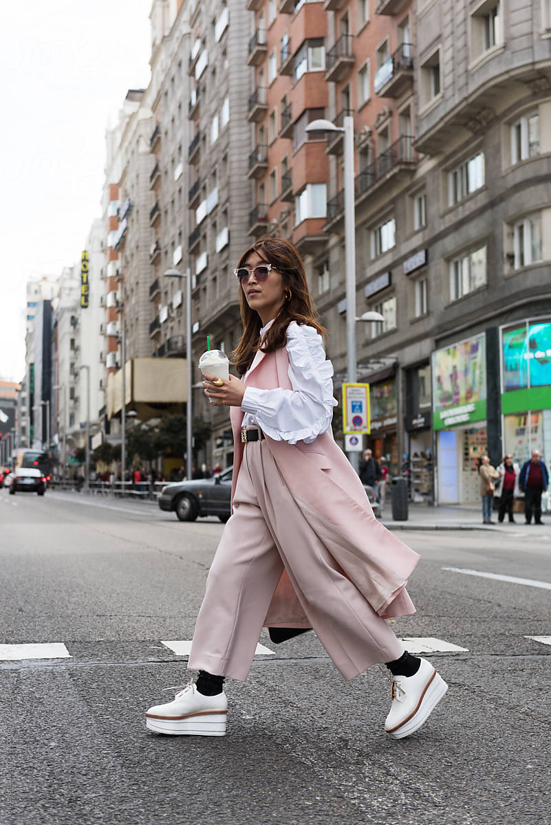 "Classy Model With Coffee Walking Down Street" by Stocksy Contributor ...
