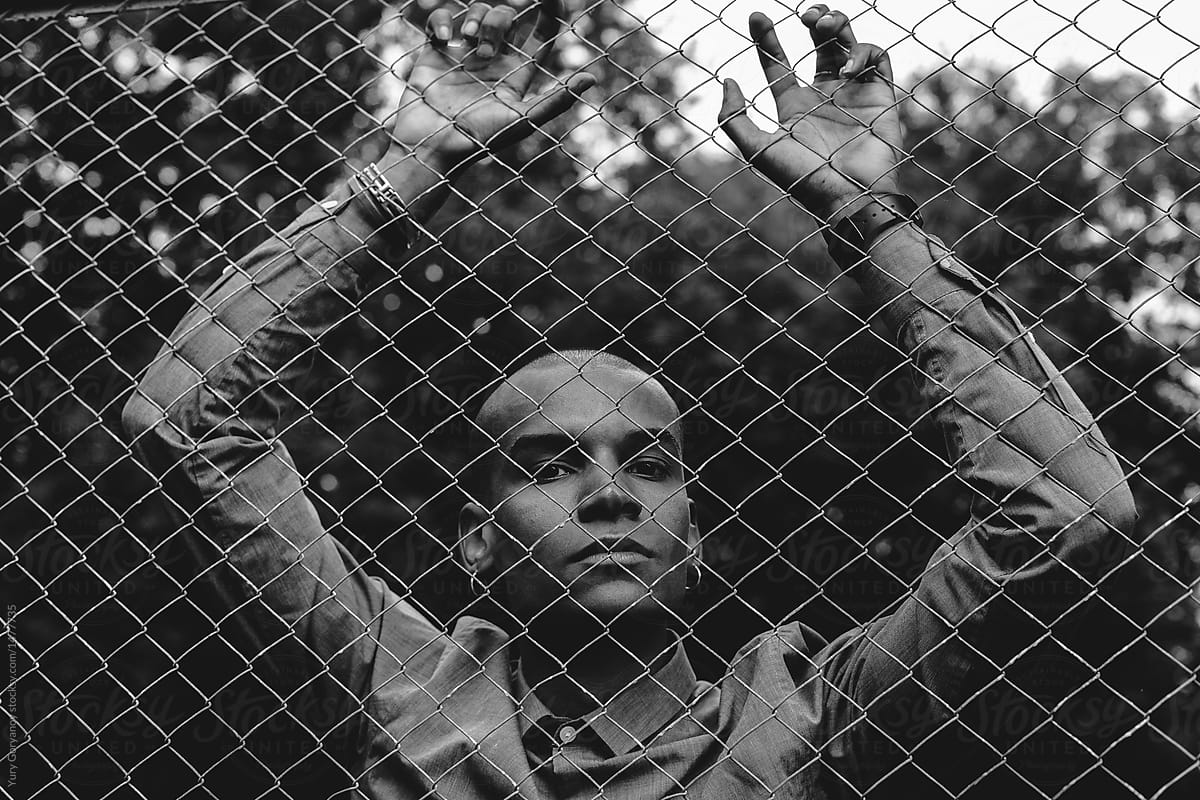 "Looking Through The Bars" by Stocksy Contributor "Yury Goryanoy" - Stocksy