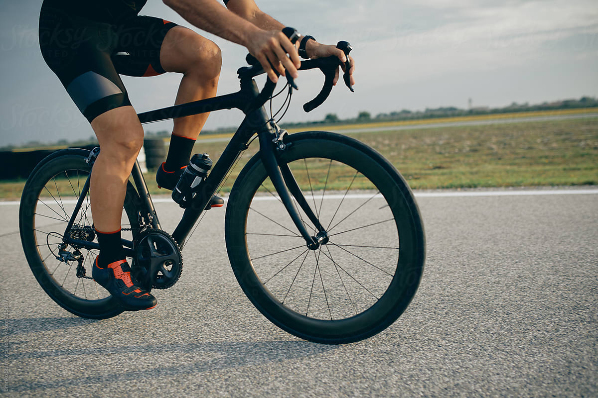 "Cyclist Racing In The Race Track." by Stocksy Contributor "Branko ...