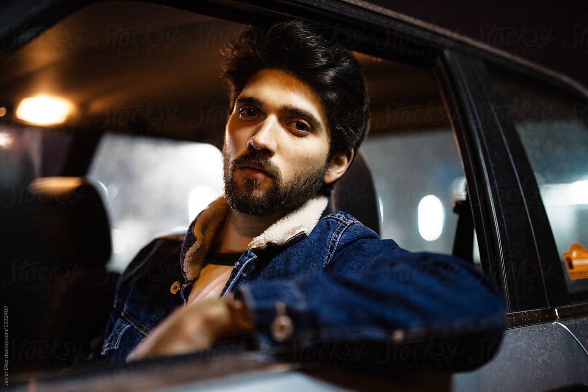 "A Car Driver Looking At Camera" by Stocksy Contributor "Javier Díez ...