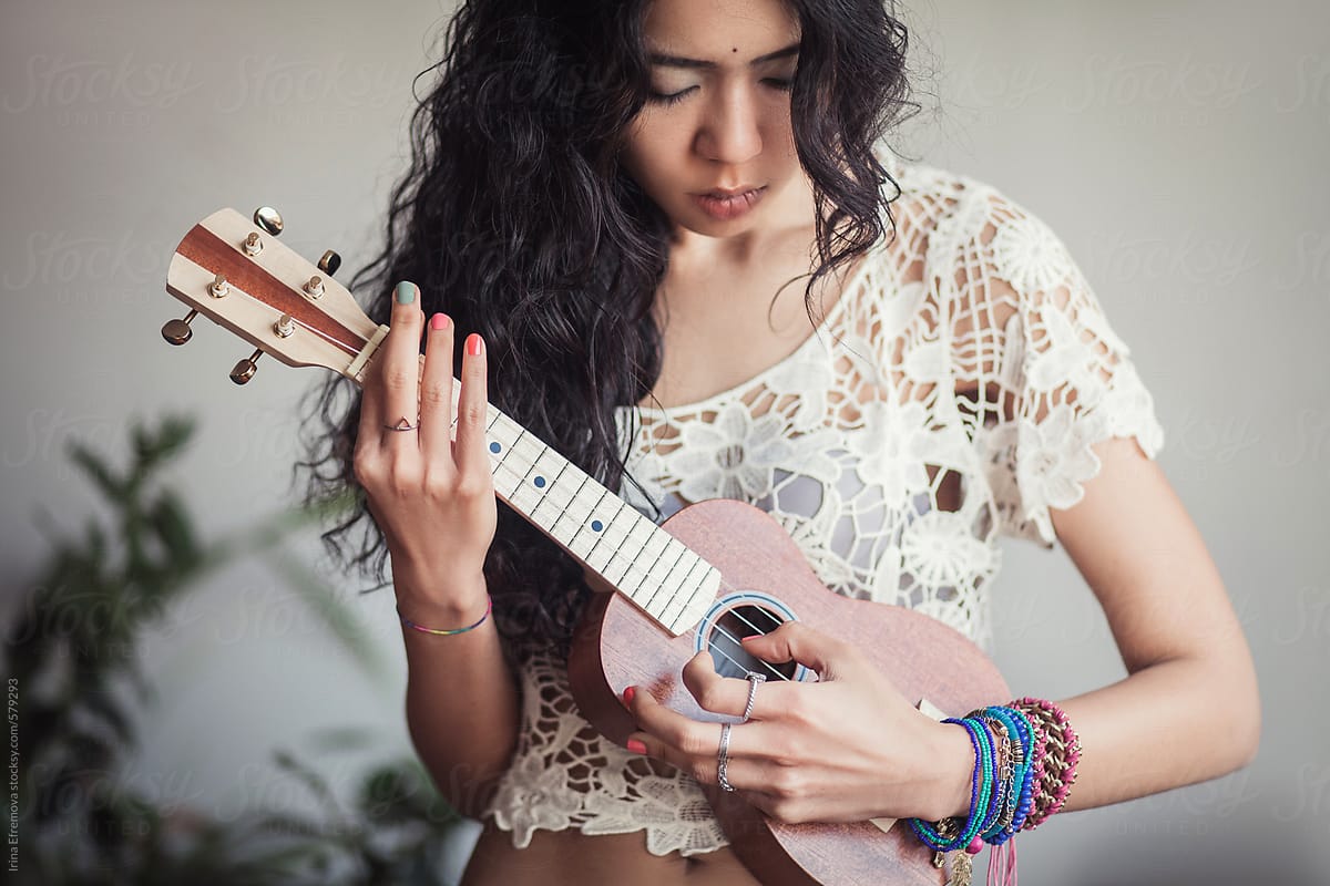 "Girl With Ukulele" by Stocksy Contributor "Irina Efremova" - Stocksy