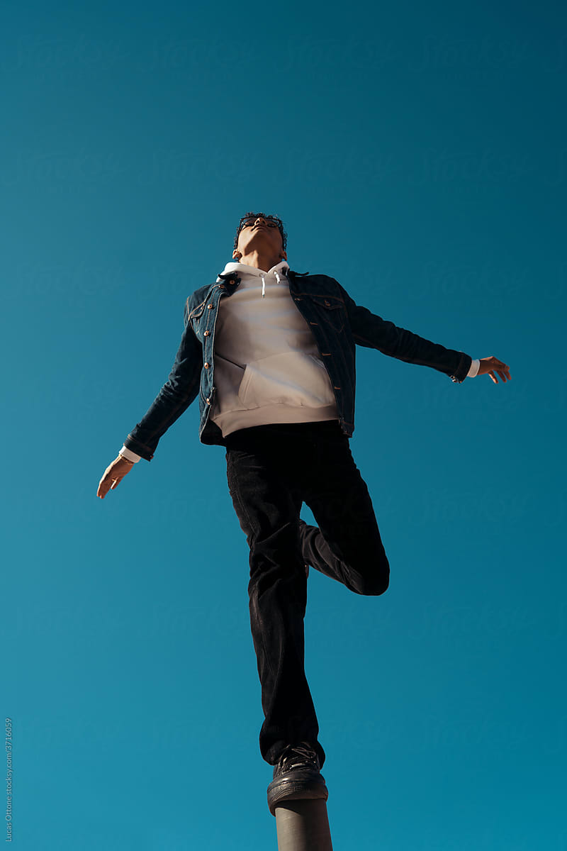 "Free Young Man Keeping Balance" by Stocksy Contributor "Lucas Ottone ...