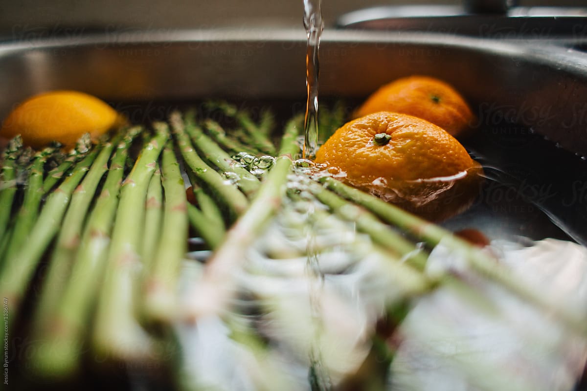 "Colorful Fruit And Vegetables Being Rinsed In Kitchen Sink At Home ...