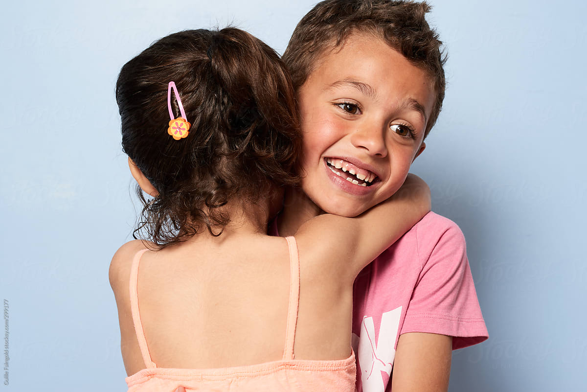"Happy Kids Hugging And Smiling" by Stocksy Contributor "Guille ...