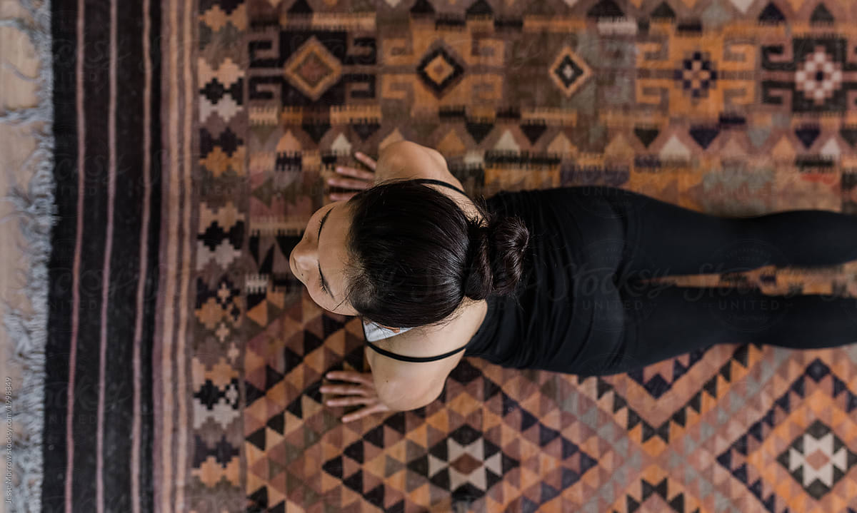 "Top Down Female Practices Yoga On Pattern Rug" by Stocksy Contributor ...