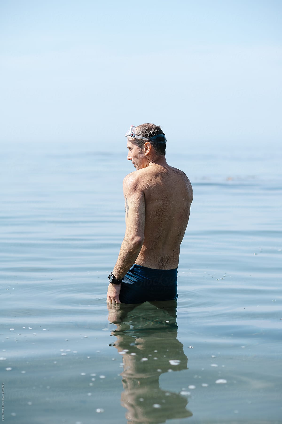 "Man Standing In The Sea, Taking A Rest From Swimming" by Stocksy ...
