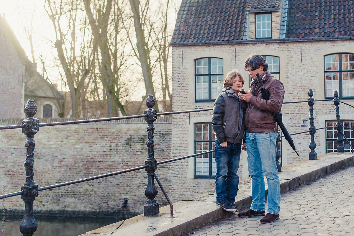 "Father And Son Texting On A Mobile Phone" by Stocksy Contributor ...