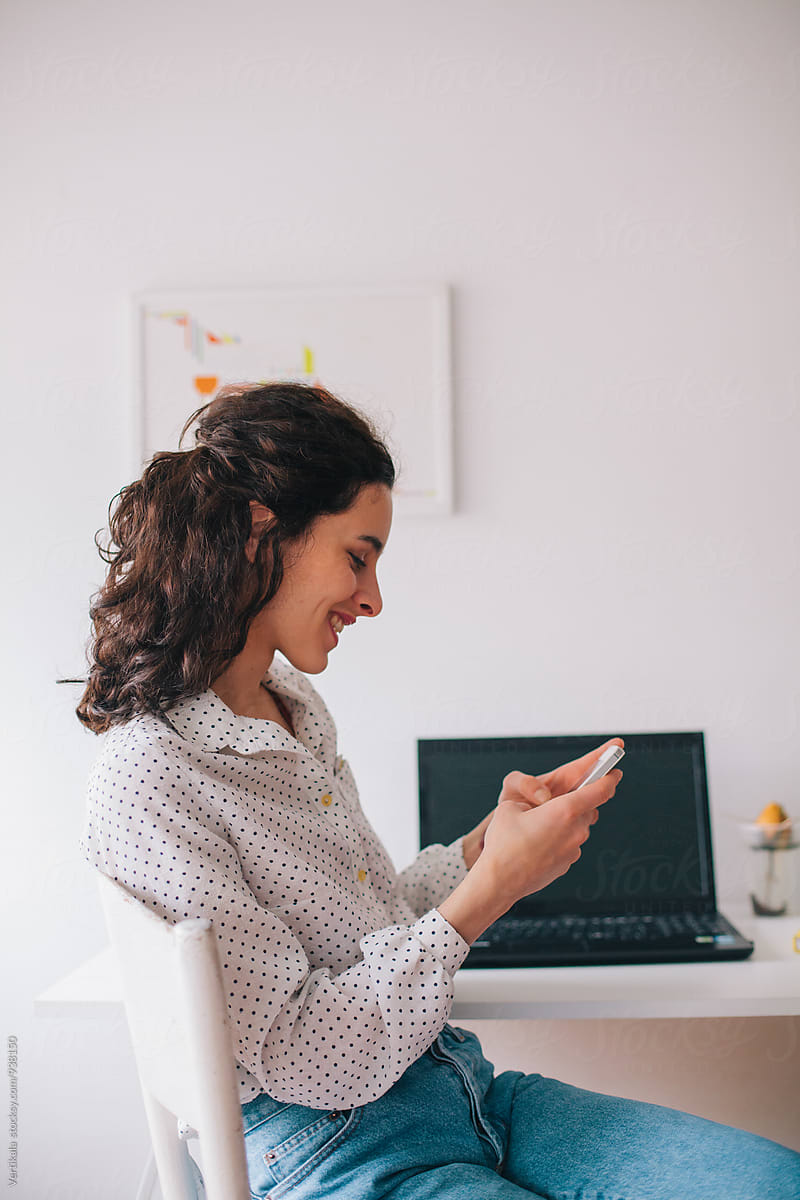 "Woman Browsing On Her Mobile Phone Indoor" by Stocksy Contributor ...