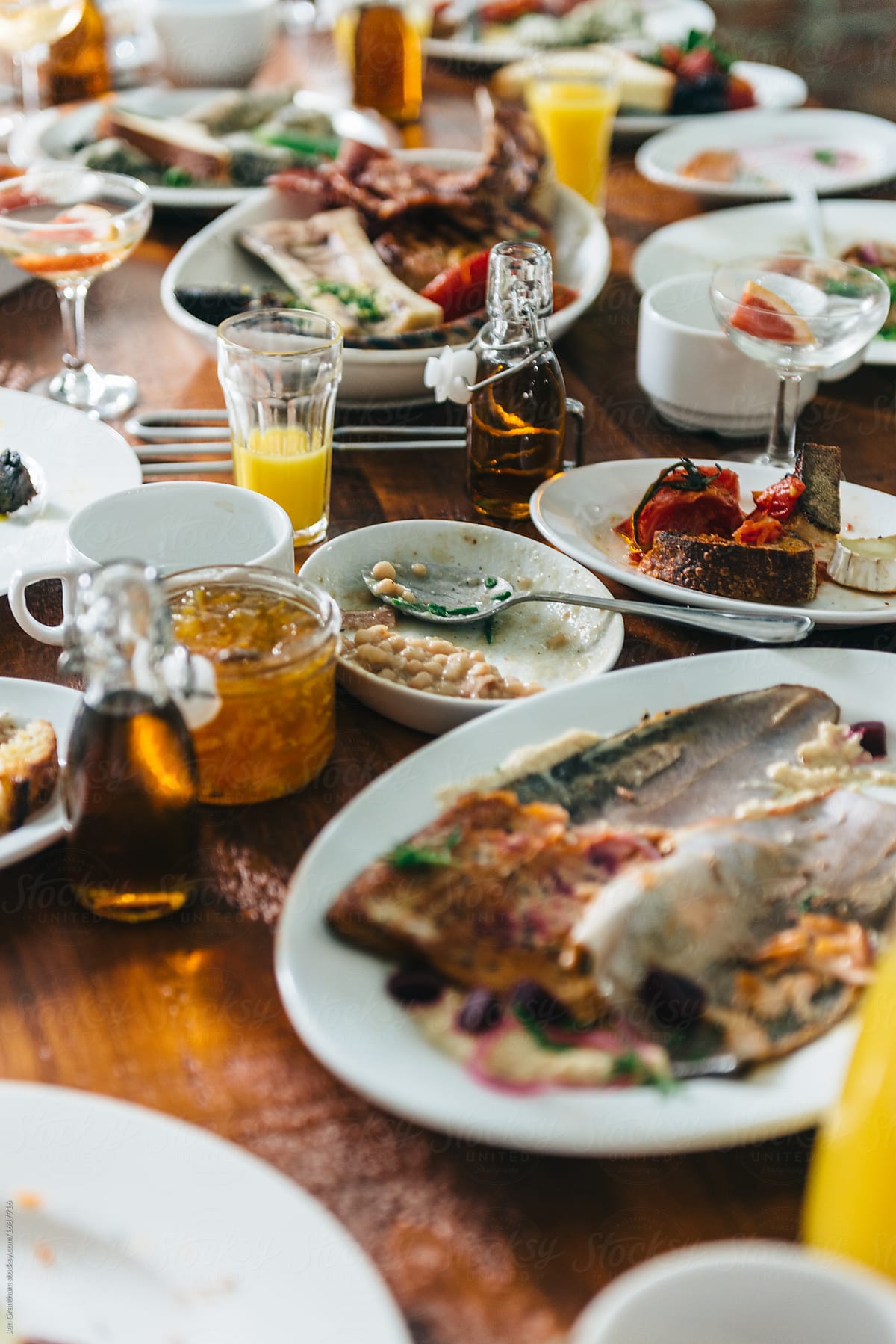 "Messy Table After Brunch" by Stocksy Contributor "Jen Grantham" - Stocksy