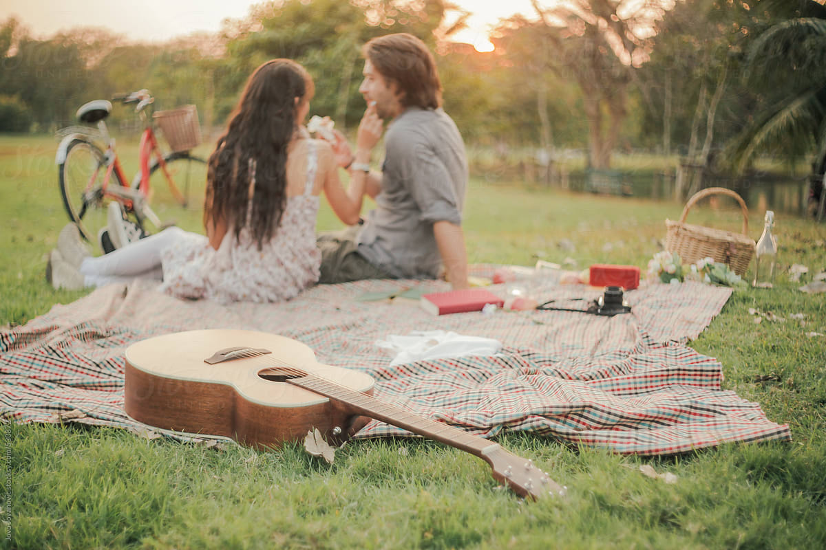 "Couple Enjoying Time Together Outdoors At A Picnic" by Stocksy ...
