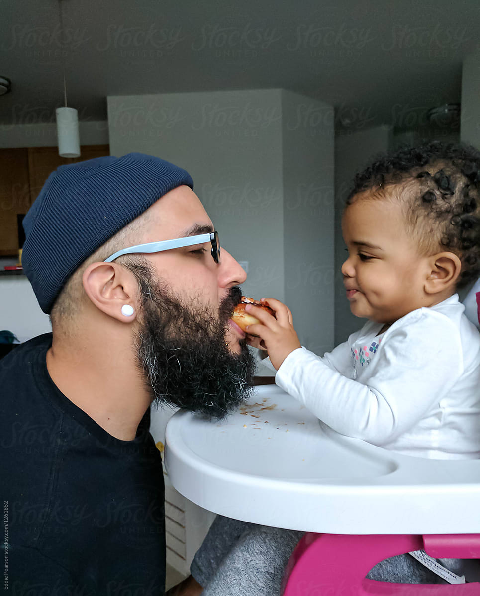 "Baby Giving Her Dad A Doughnut" by Stocksy Contributor "Eddie Pearson ...
