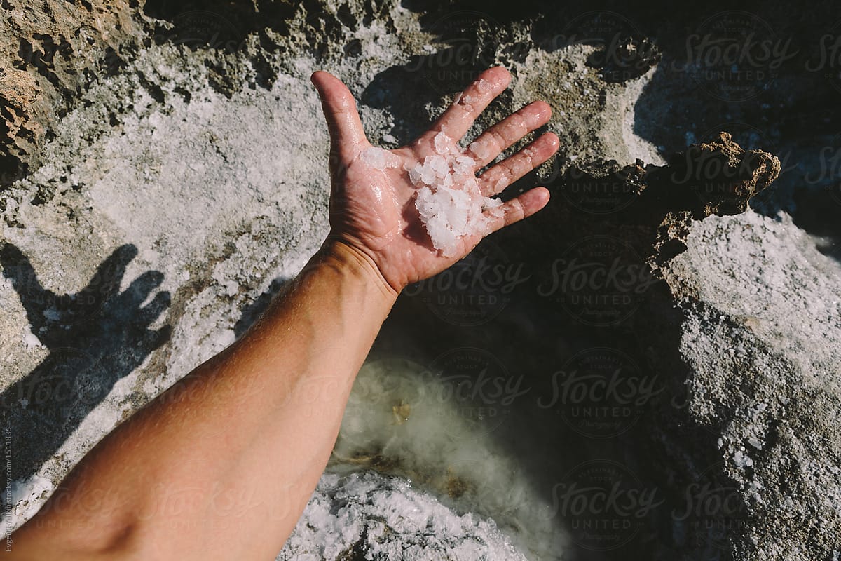"Sea Salt In Hand" by Stocksy Contributor "Evgenij Yulkin" - Stocksy