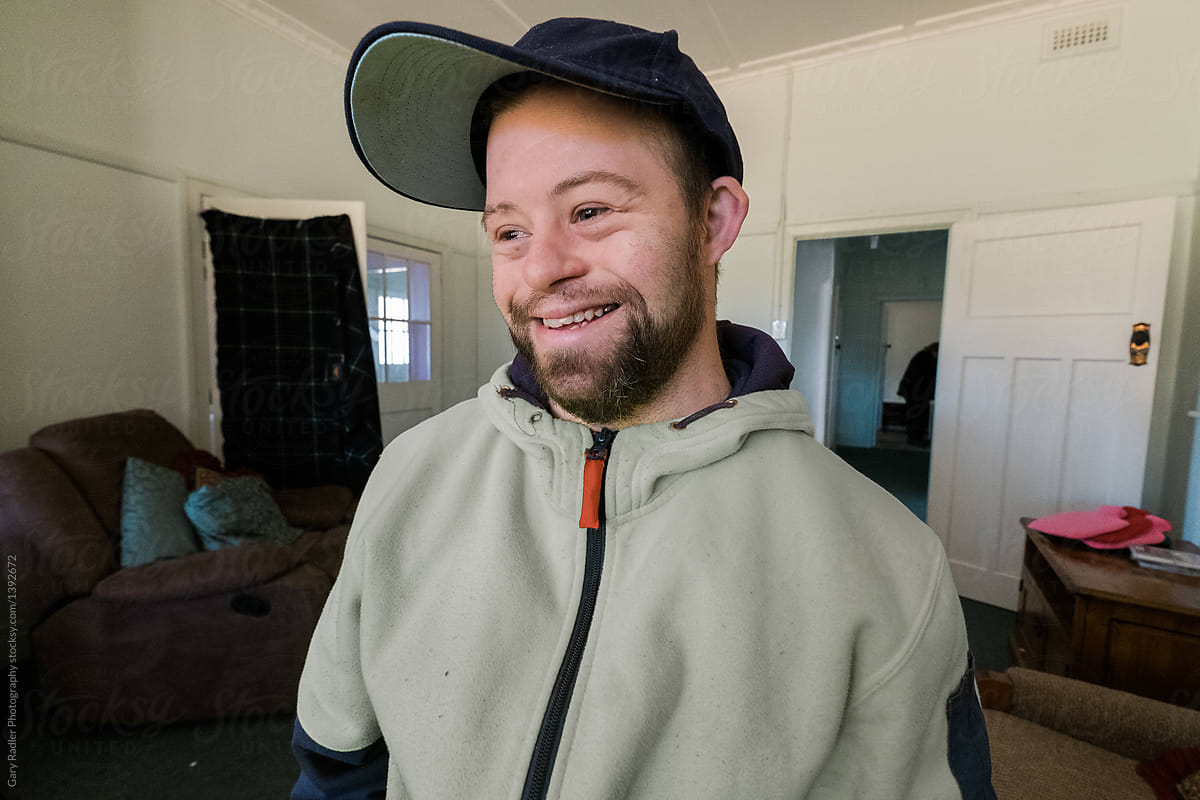 "Man With Baseball Cap Smiling In A Loungeroom" by Stocksy Contributor ...