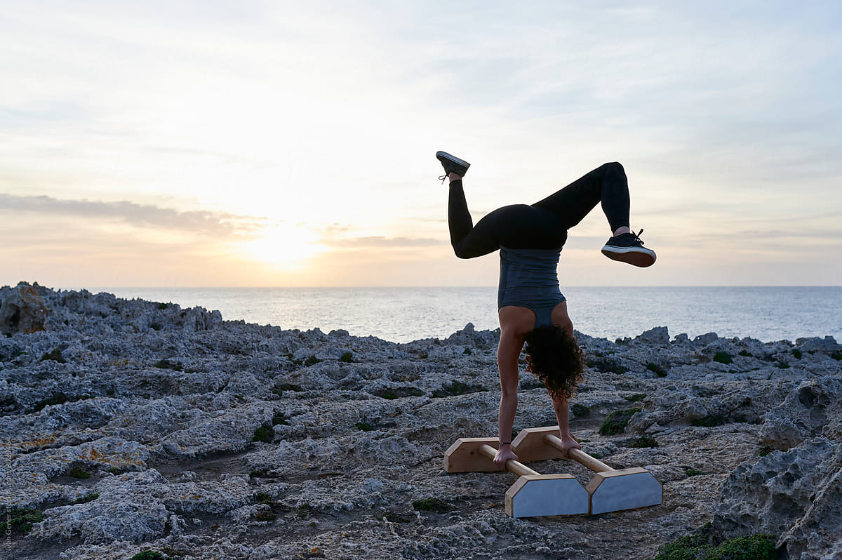 "Fit Woman Doing Handstands By The Ocean" by Stocksy Contributor "Ivan ...