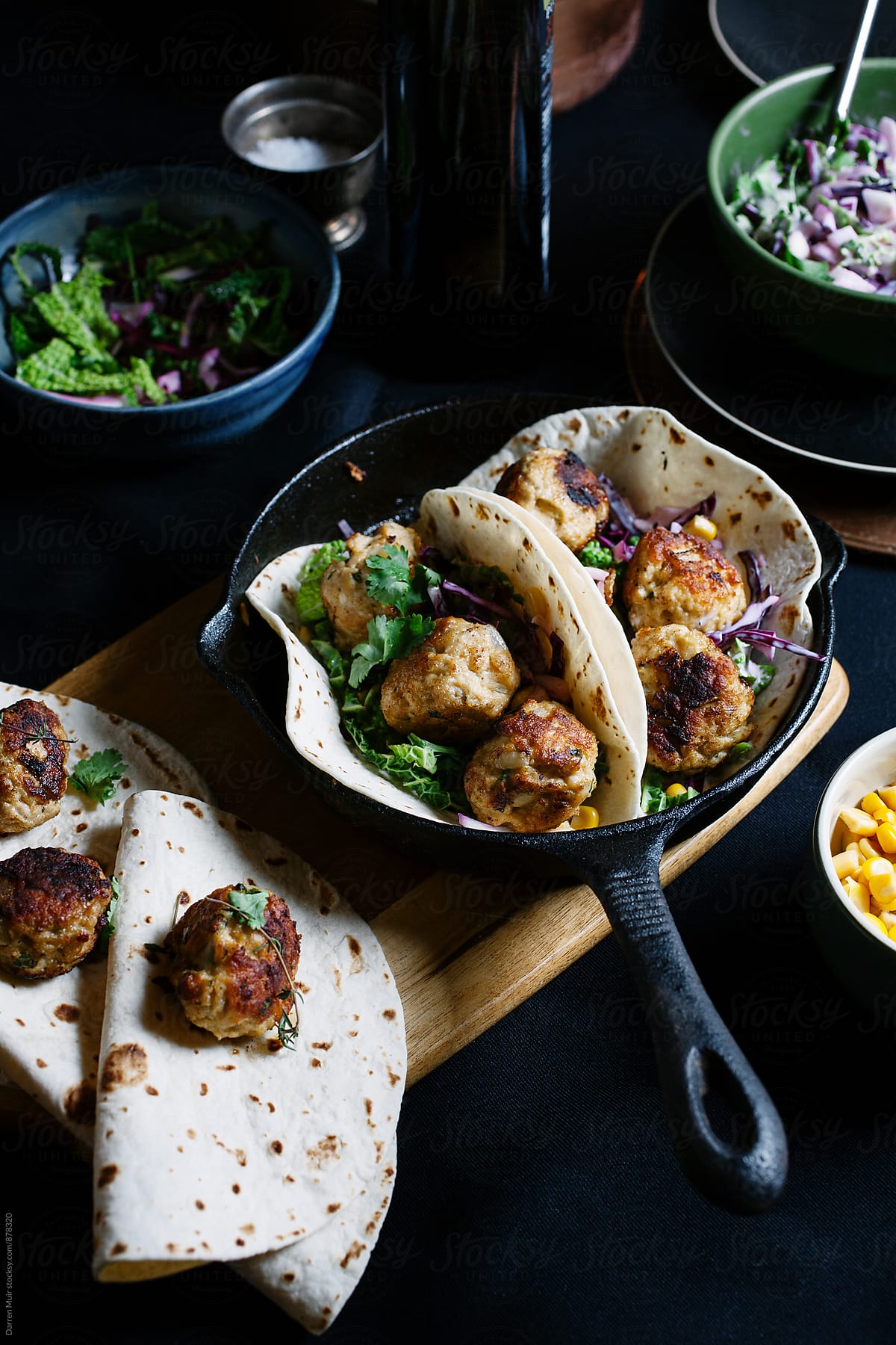 "Taco's On A Table Surrounded By Side Dishes." by Stocksy Contributor ...