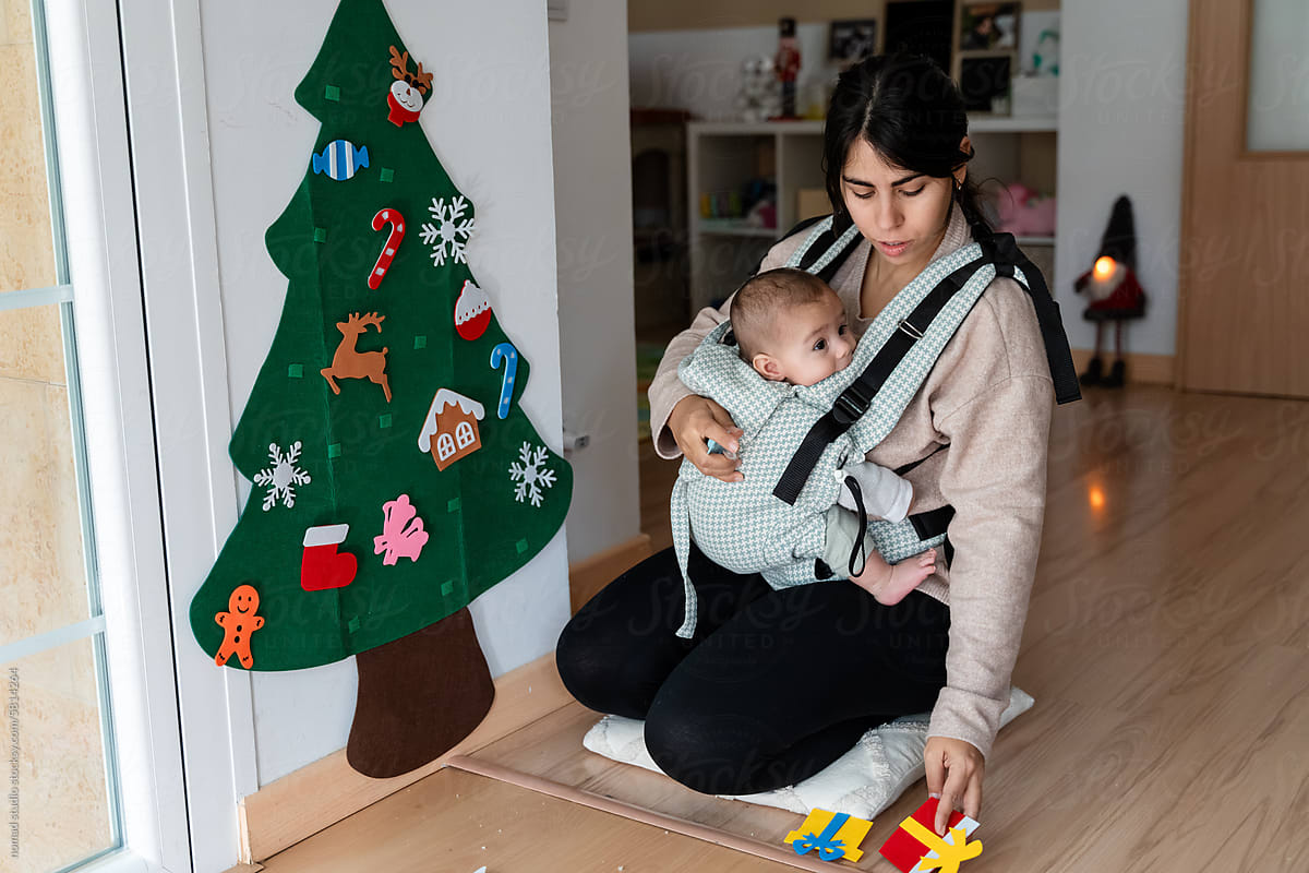 "Mother And Baby With Christmas Decoration" by Stocksy Contributor ...